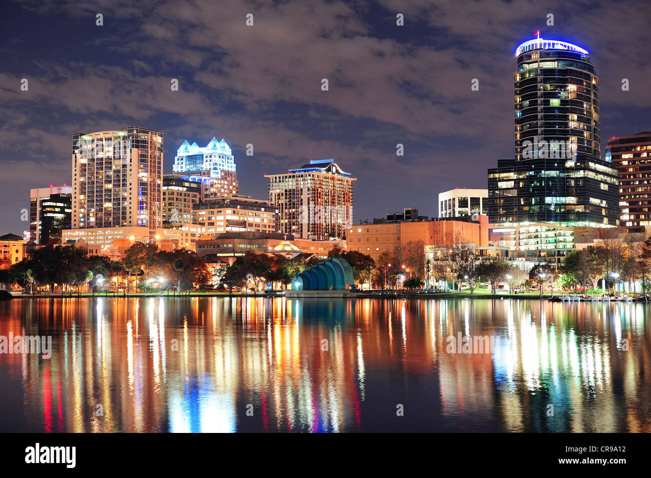 Orlando downtown skyline over Lake Eola at dusk with urban skyscrapers ...