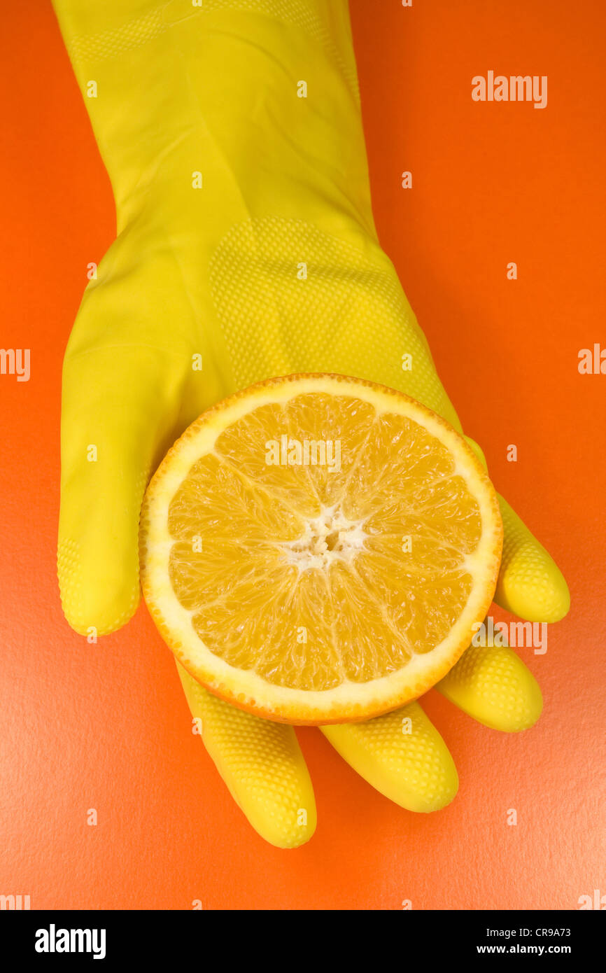 citrus fruit on human hand . isolated on orange background Stock Photo ...