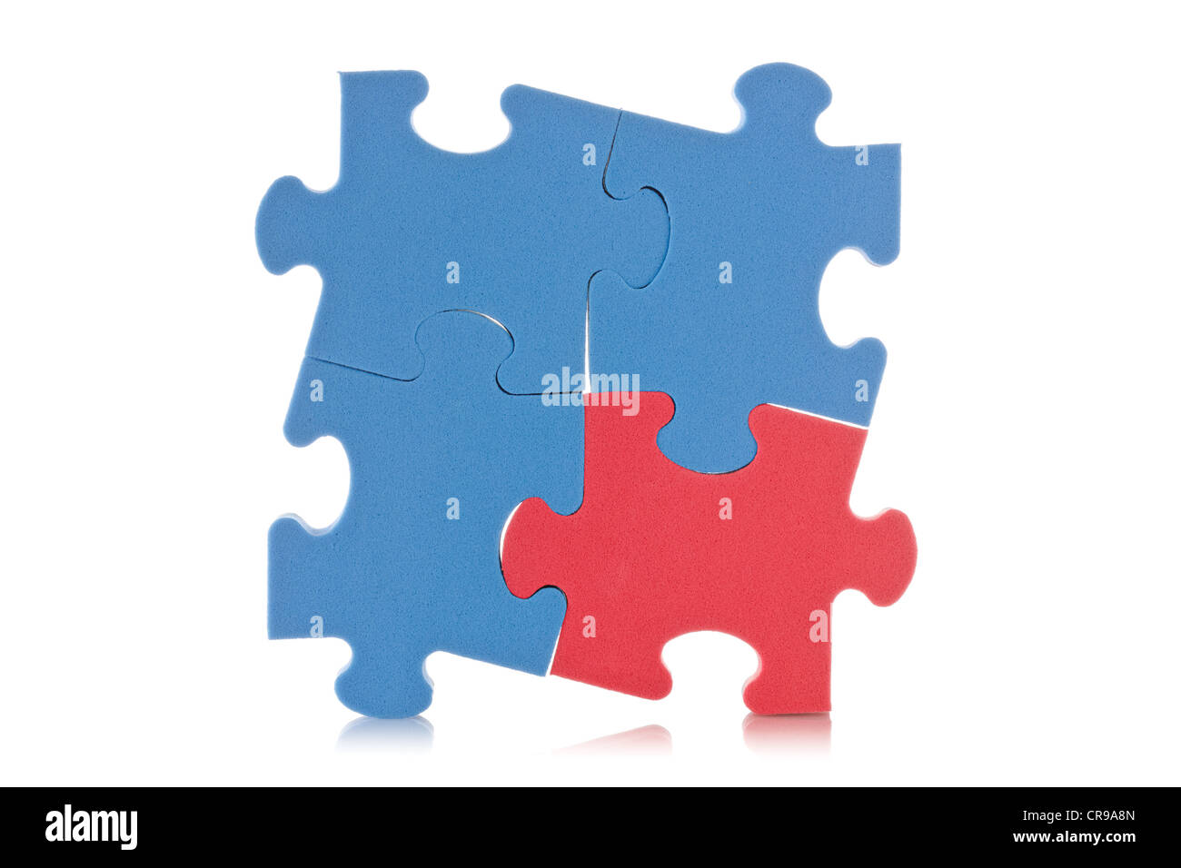 blue puzzle sign with one red piece Stock Photo - Alamy