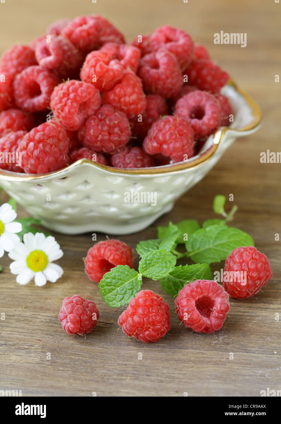 juicy ripe raspberries with mint leaves Stock Photo - Alamy