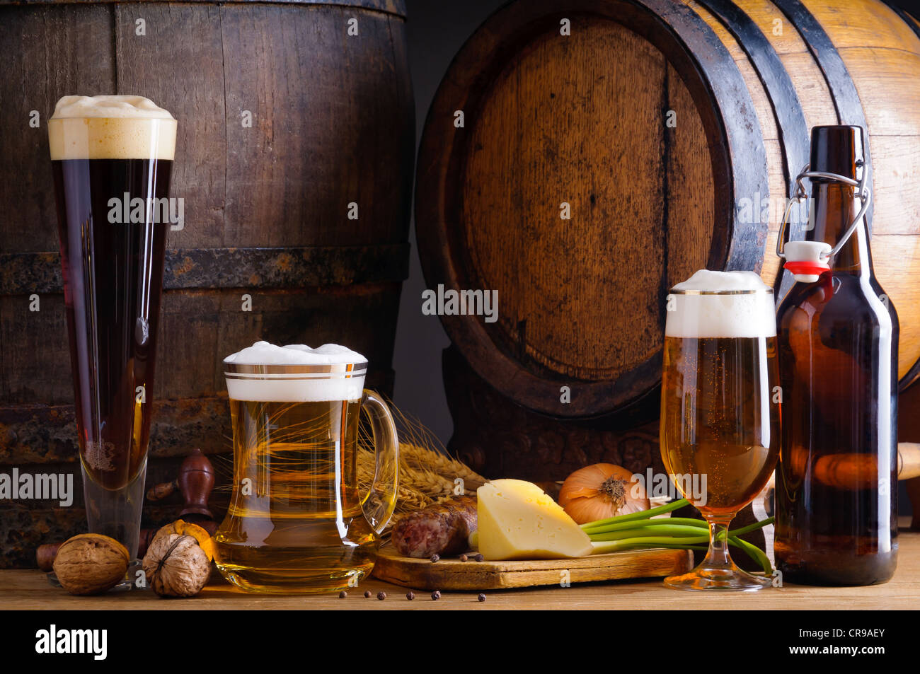 Cellar still life with beer, traditional food and barrels Stock Photo ...