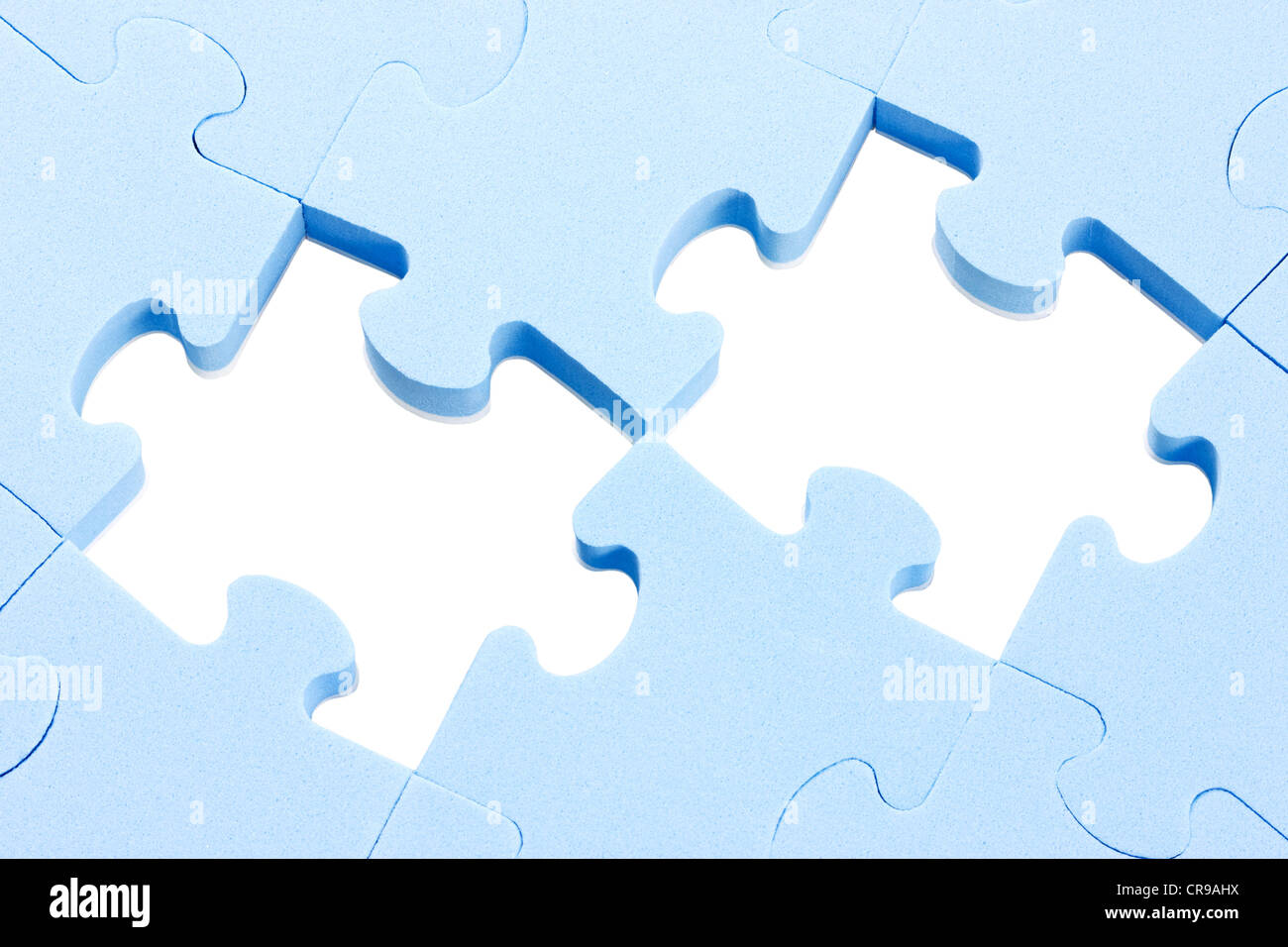 blue puzzle background with two missing pieces Stock Photo - Alamy