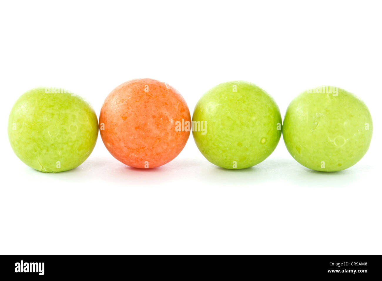 row of chewing gum balls on white background Stock Photo - Alamy