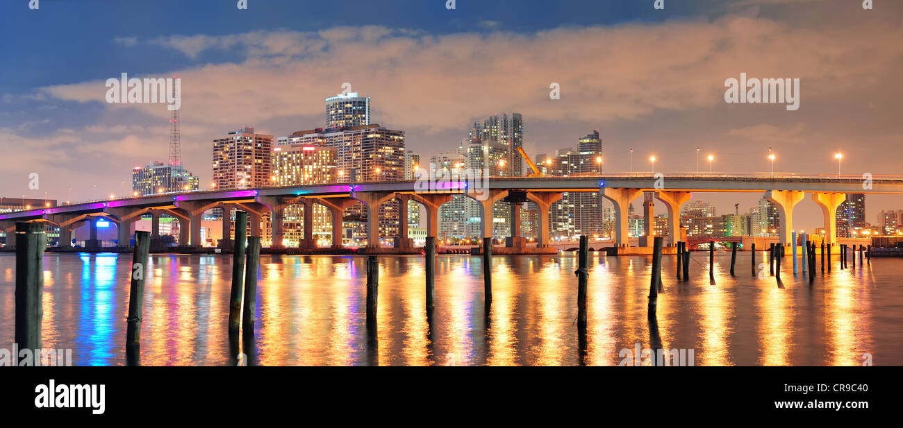 Miami city skyline panorama at dusk with urban skyscrapers and bridge ...