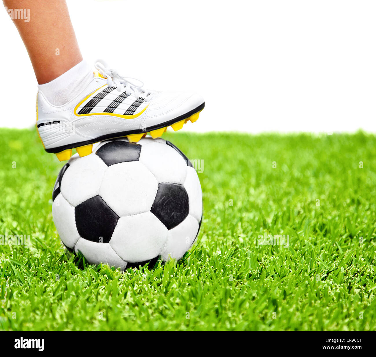 Football player, men foot on the ball, playing sport game at outdoor ...