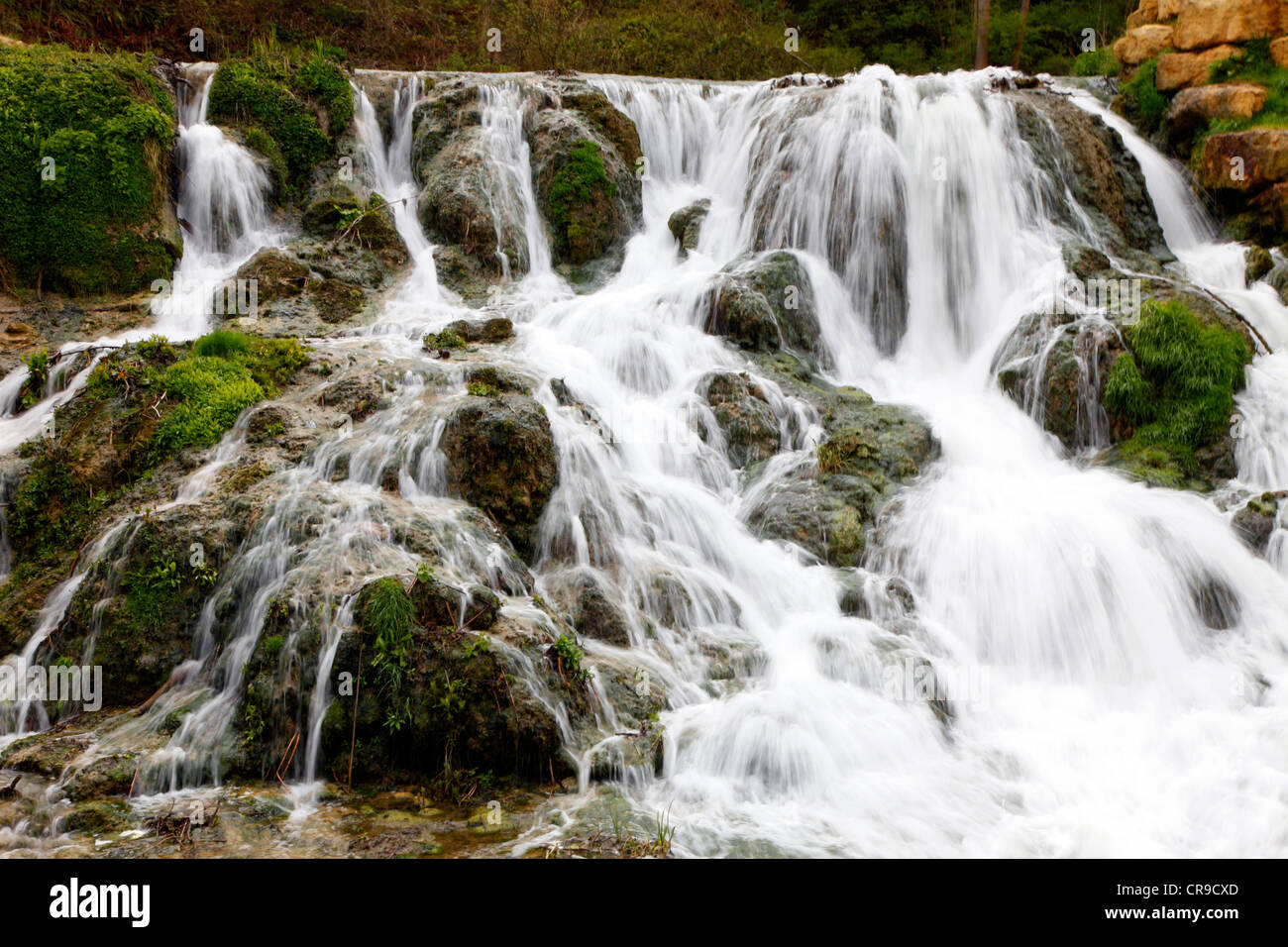 Waterfall, water flows down, over rocks. Little creek, river Stock ...