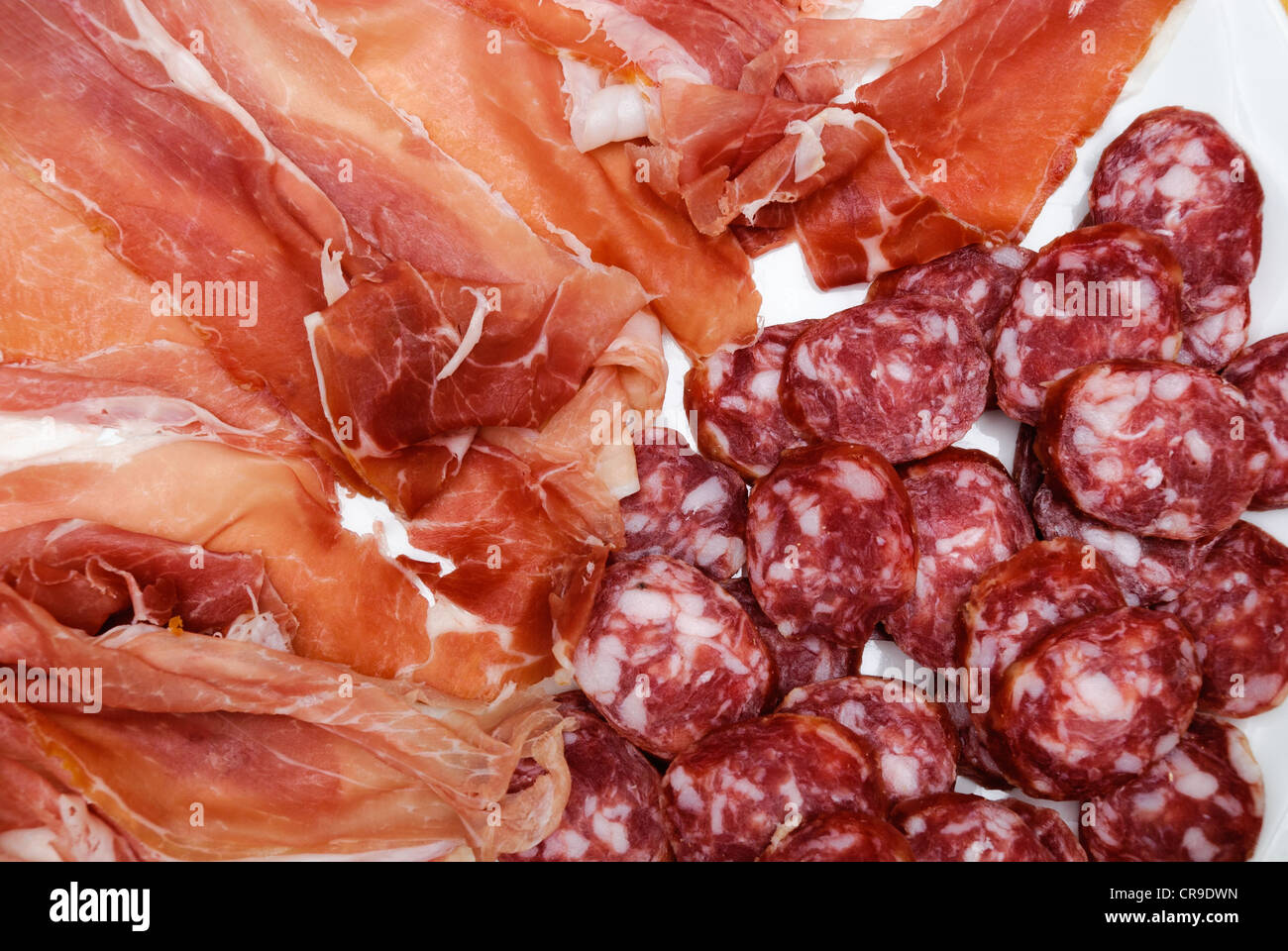 salami and ham on a platter Stock Photo - Alamy