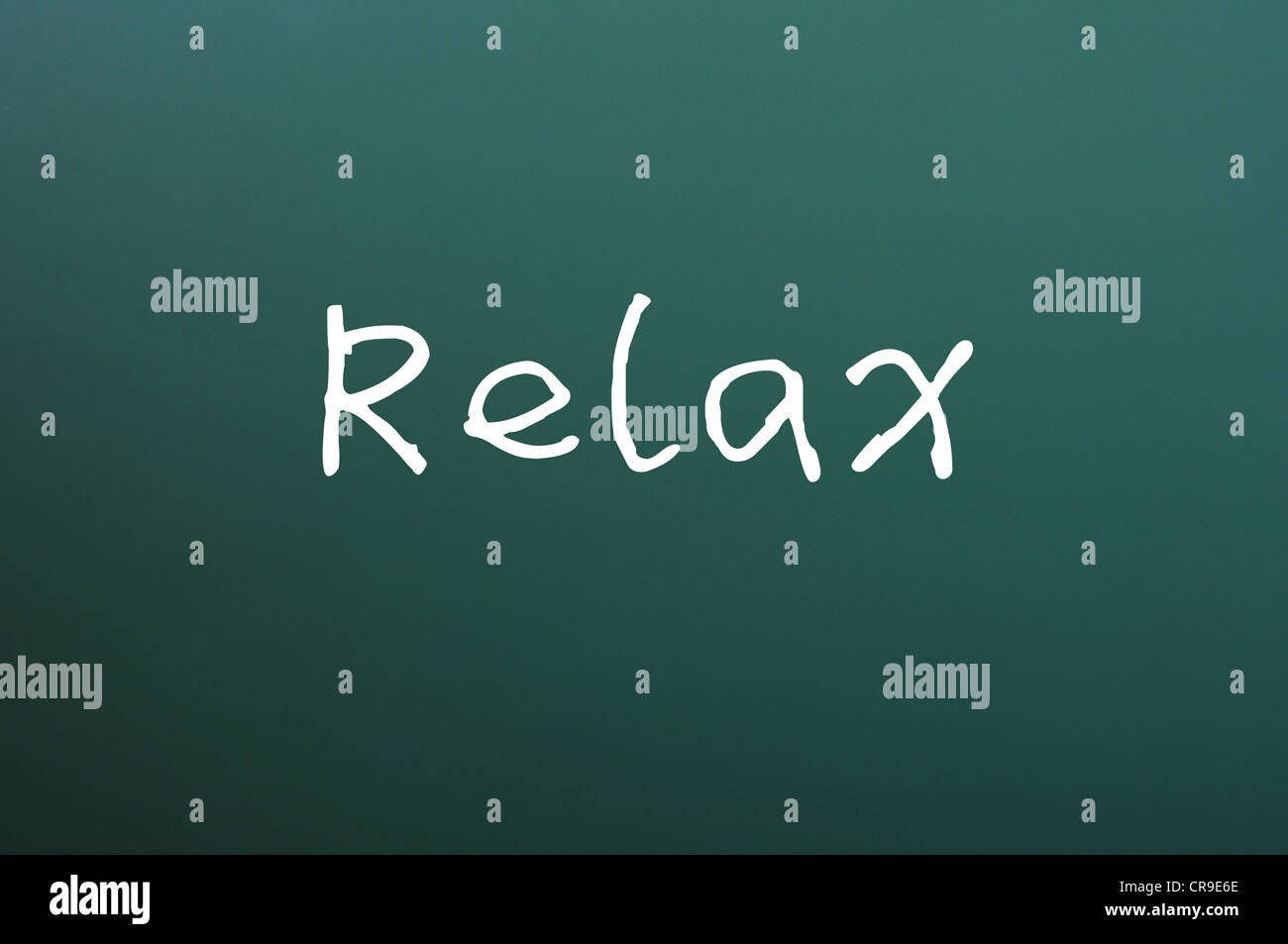 Relax written with chalk on a green chalkboard Stock Photo - Alamy