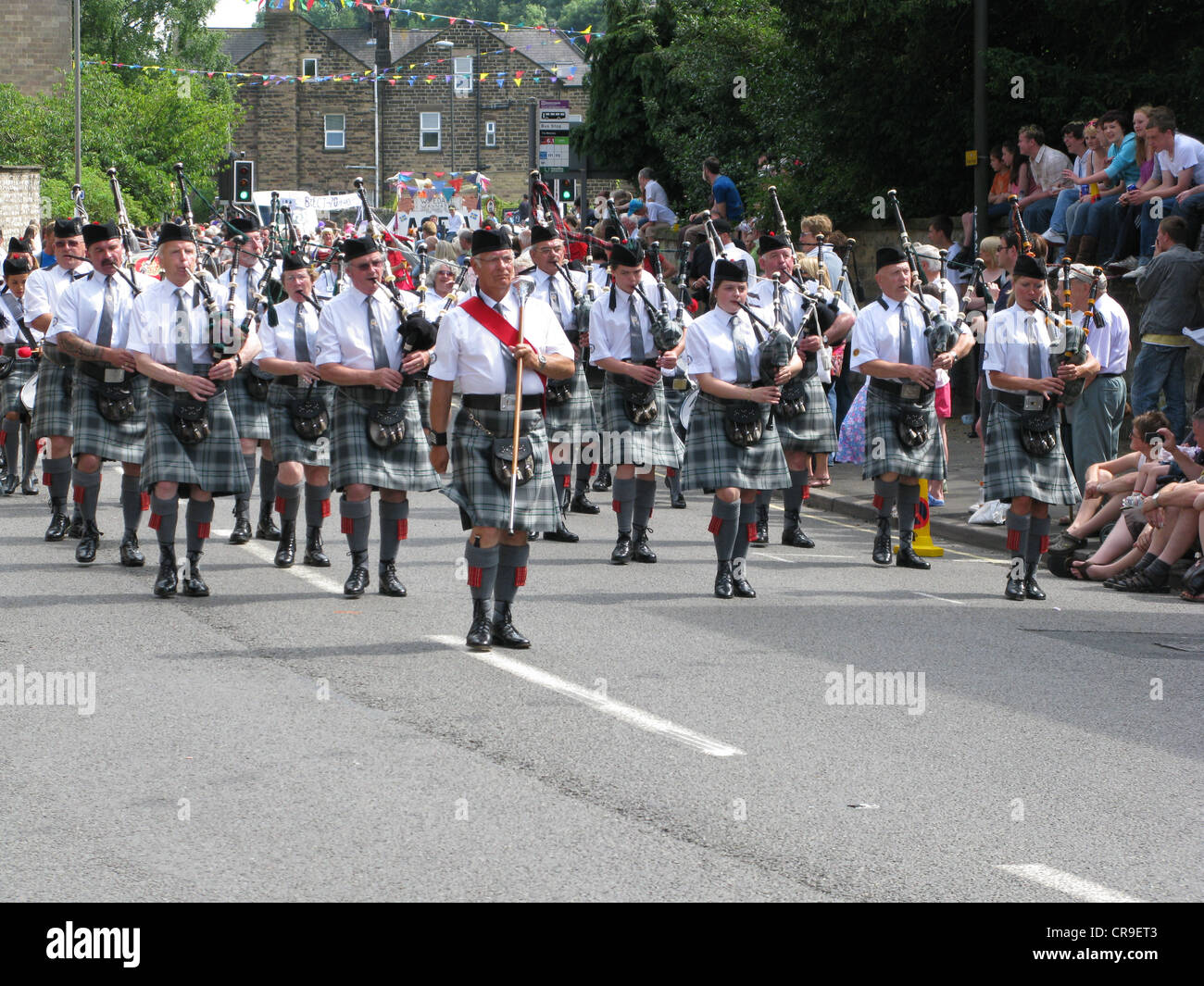 Bakewell carnival parade in Derbyshire 2009. marching band in kilts ...