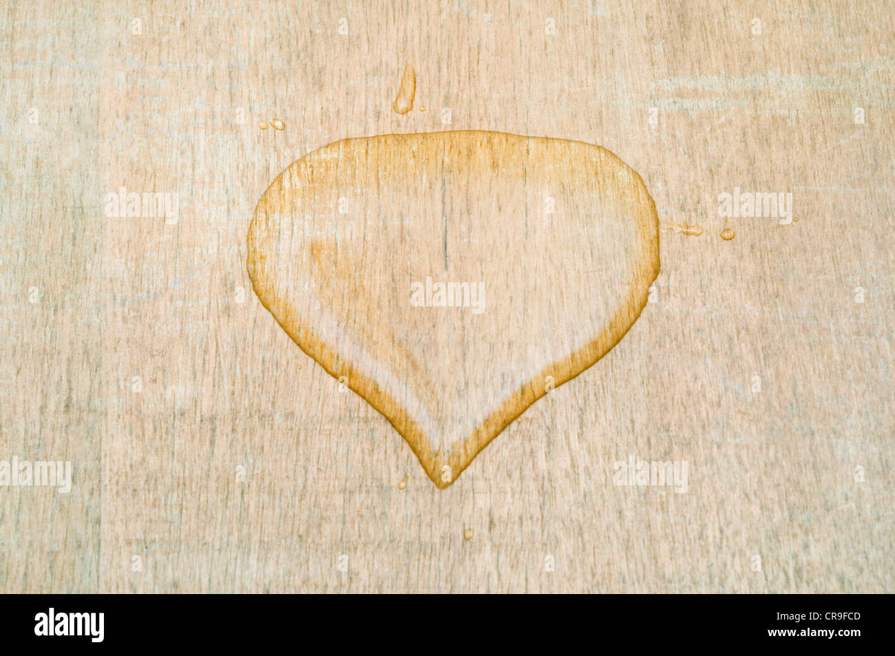 heart shape water drop on wood Stock Photo - Alamy