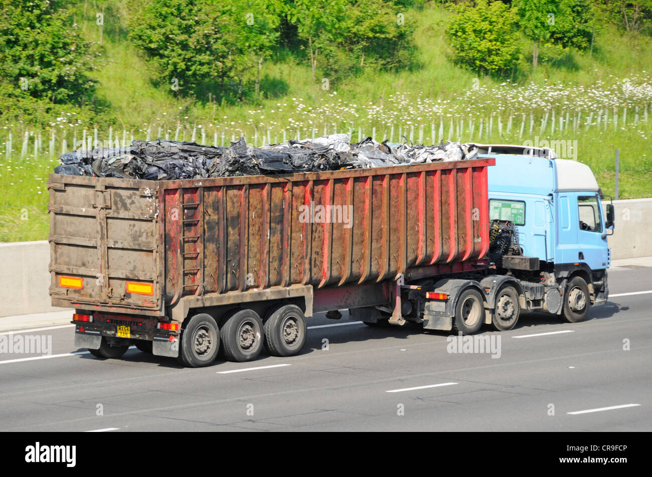 Lorry with trailer loaded with scrap metal on motorway Stock Photo - Alamy