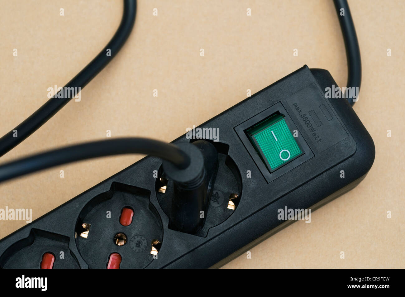 electrical plug in multiple socket Stock Photo - Alamy