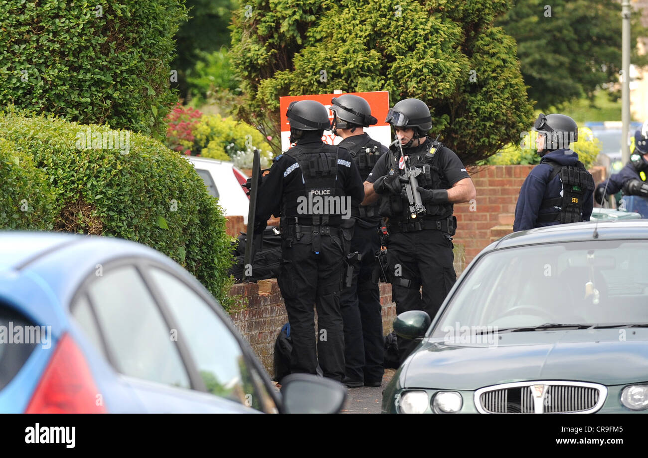 Police some of them armed surround a house in Colbourne Avenue Brighton ...