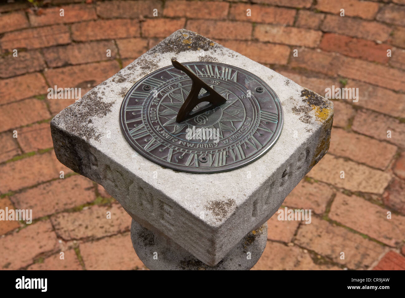 Sun dial in ornamental garden Stock Photo - Alamy