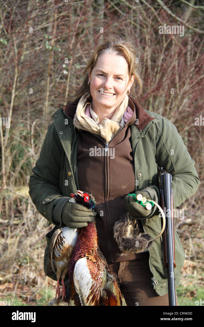 Lady with shot pheasants Stock Photo - Alamy