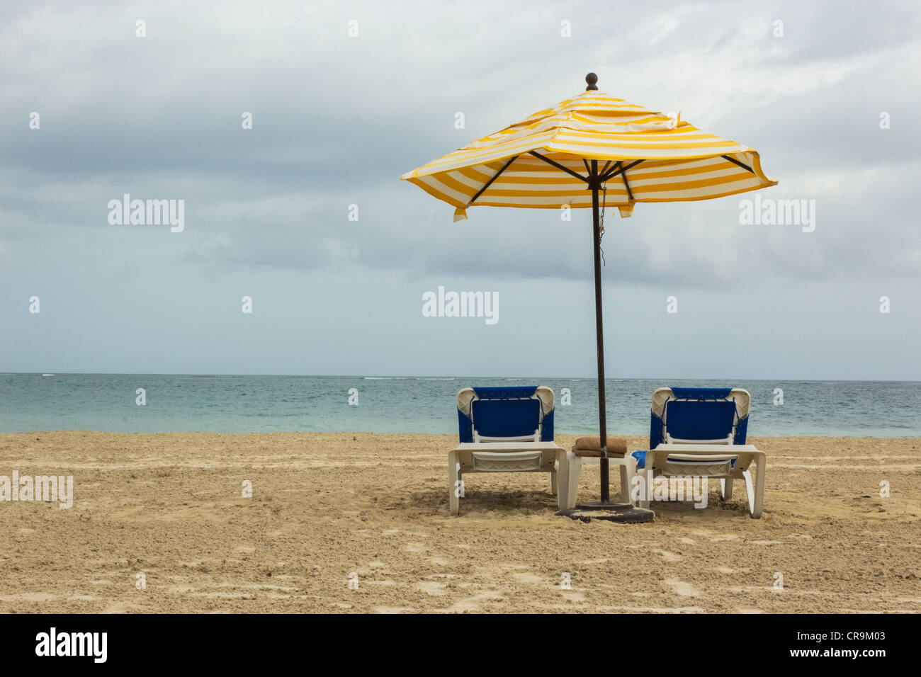 This is a beach setup that looks deserted due to the overcast day Stock ...