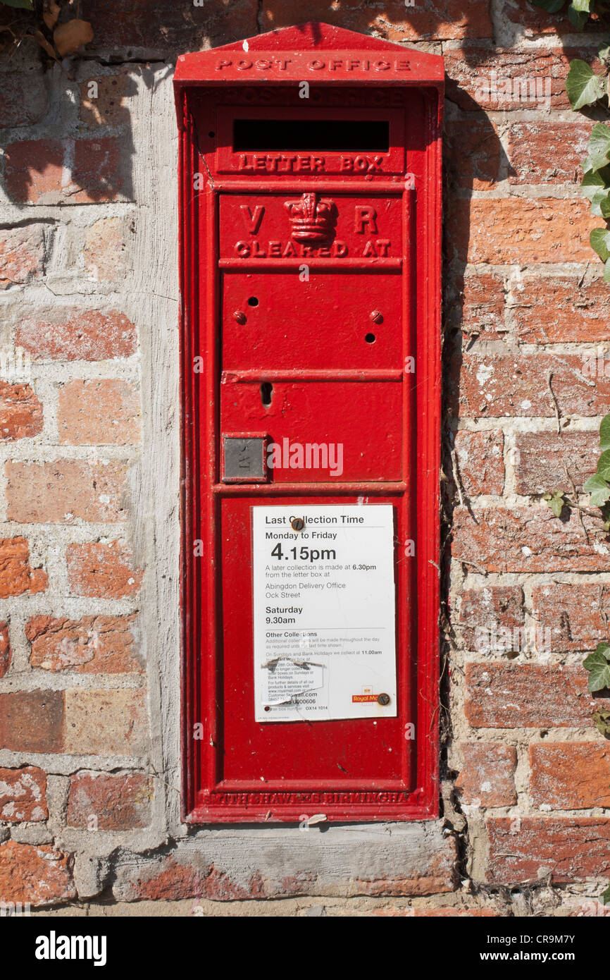 A Victorian Pillar Box in a brick wall in the English country village ...