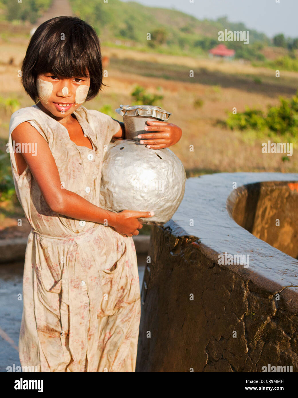 myanmar water girl mrauk u Stock Photo - Alamy