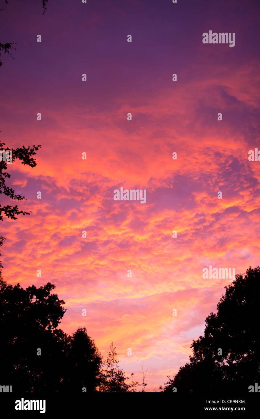 Deep red sunset over a residential house Stock Photo - Alamy