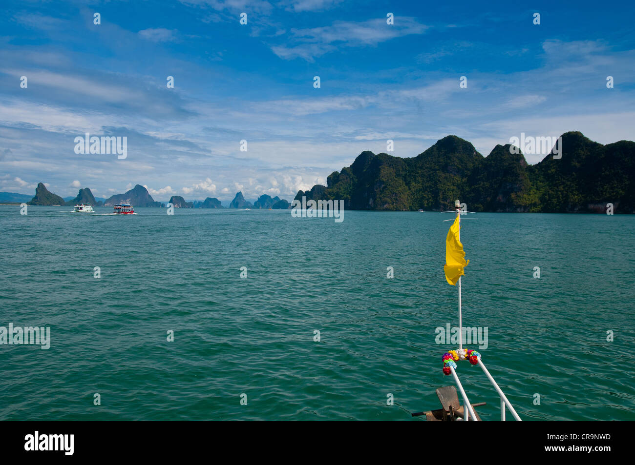 Yellow flag of a ferry in the national park of Phang Nga, Thailand ...