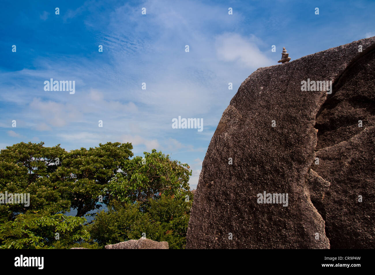 Pyramid of stones on huge rock on Similan islands Thailand Stock Photo ...