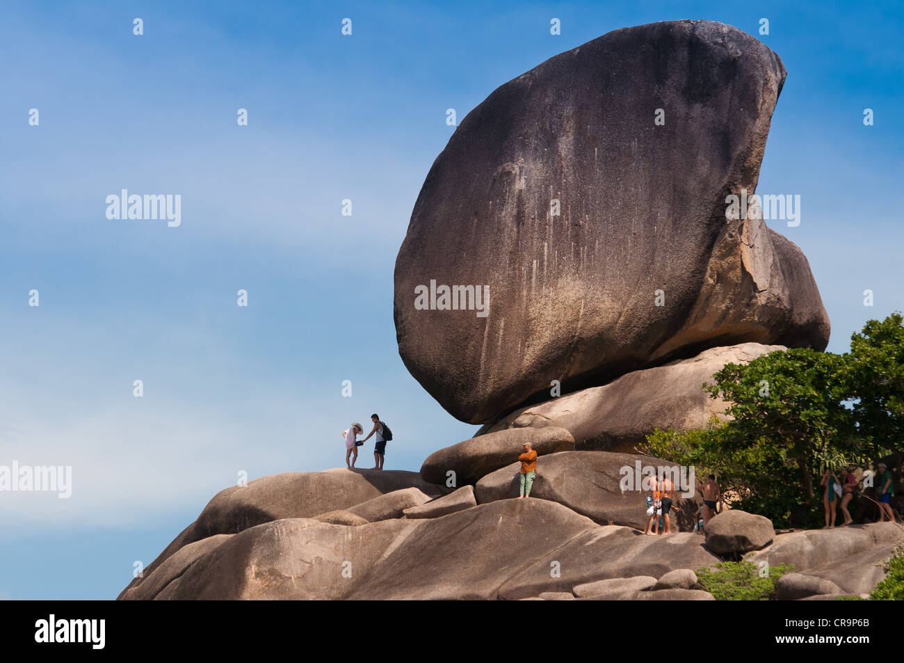 People climbing to the Sail rock on Similan islands in Thailand Stock ...