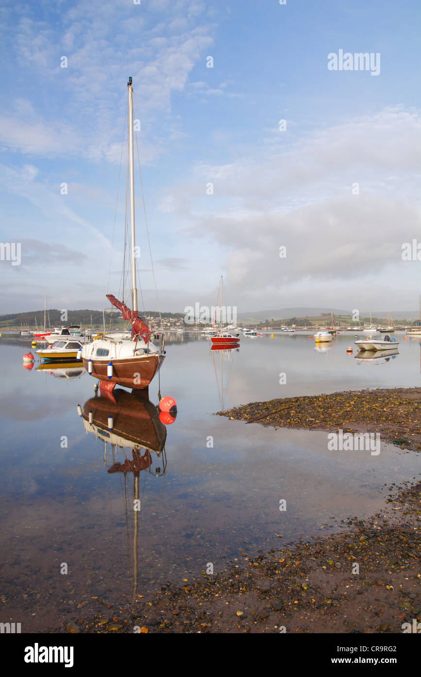 A boat waits for the incoming tide to arrive on the River Exe, at dawn ...