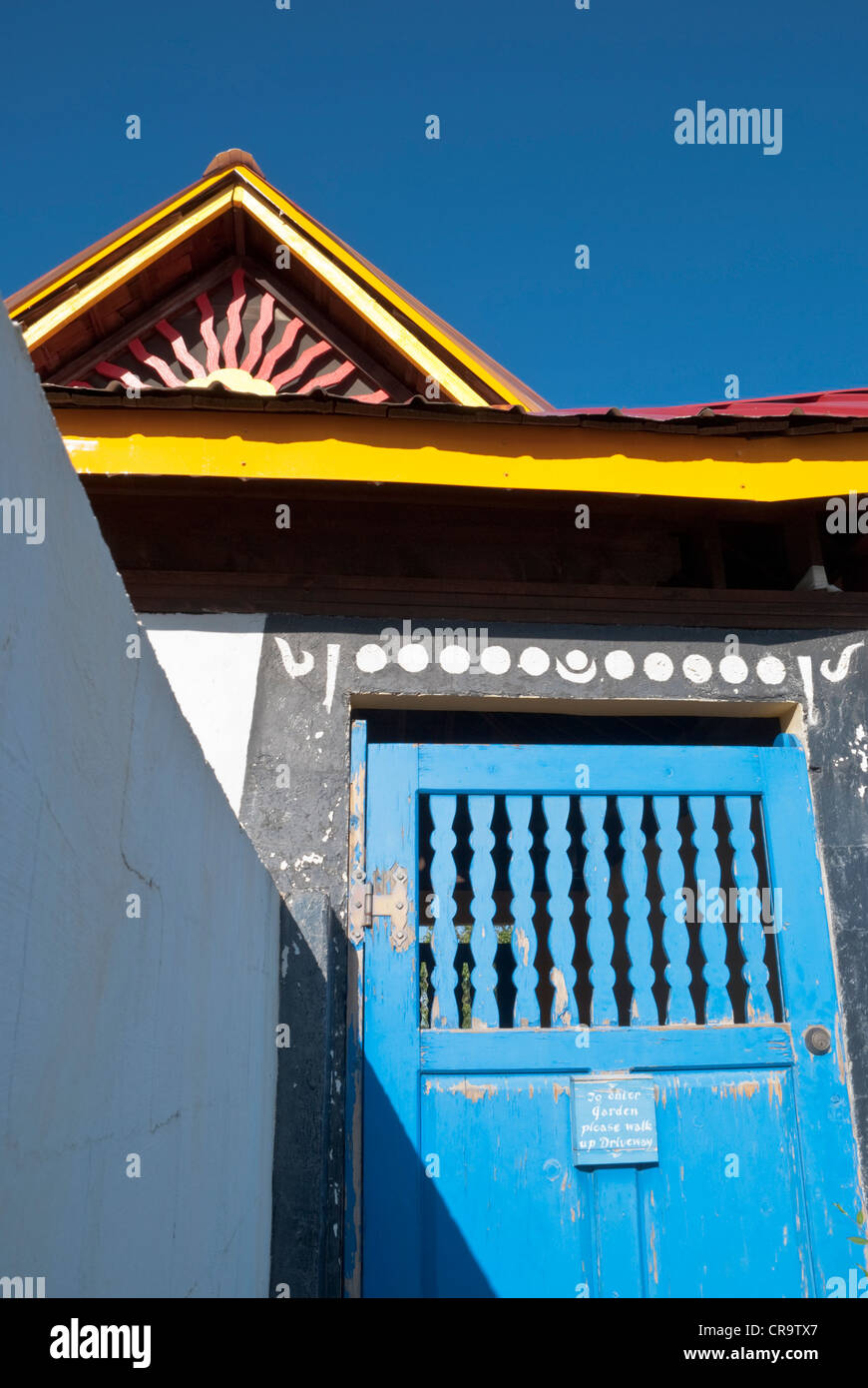 A blue gate on an outbuilding tempts visitors to go inside Stock Photo ...