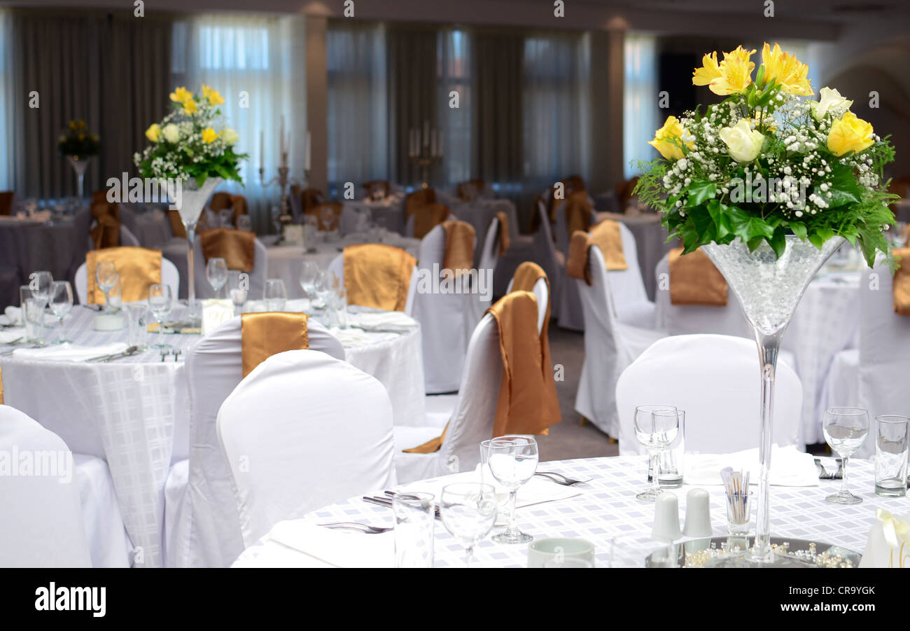 Fancy table set for a wedding with beautiful yellow flowers Stock Photo ...