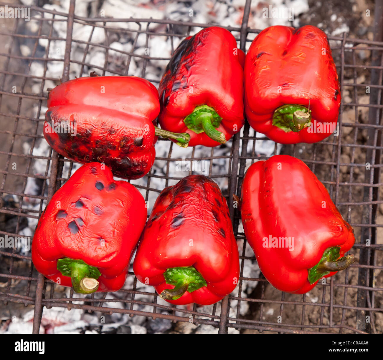 Red grilled pepper on bbq fireplace Stock Photo - Alamy