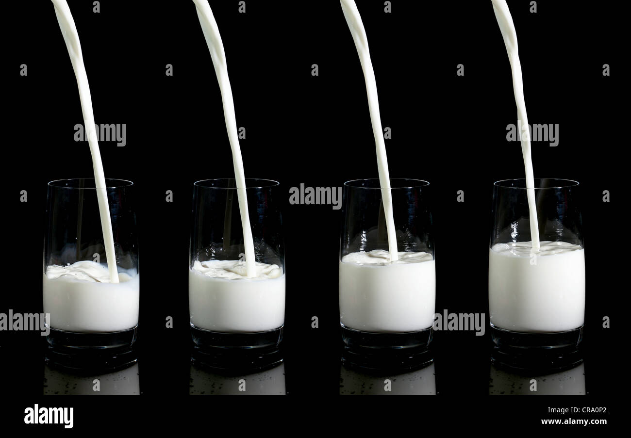 Collage of Pouring Milk in Glass, on black background Stock Photo - Alamy