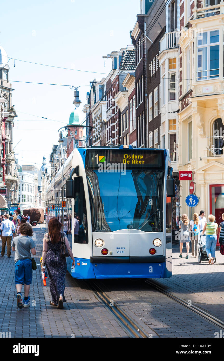 Tram running in the city centre amongst pedestrians Stock Photo - Alamy