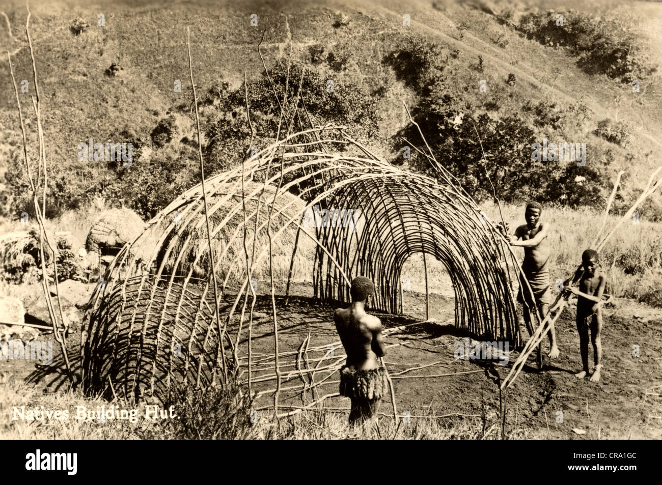 Two African Men & Boy Constructing a Reed Dwelling Stock Photo - Alamy