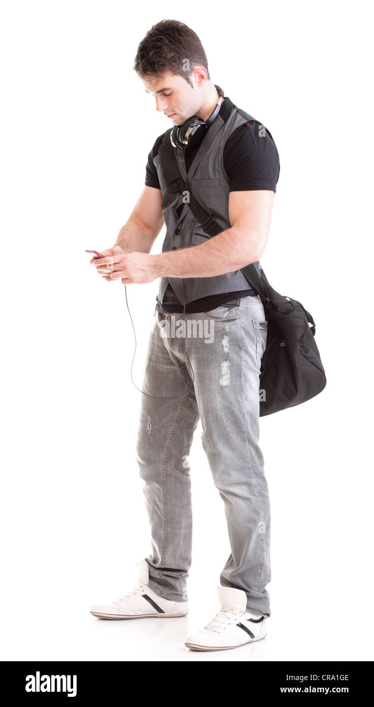 Full length portrait school boy with phone isolated on white. Music or ...