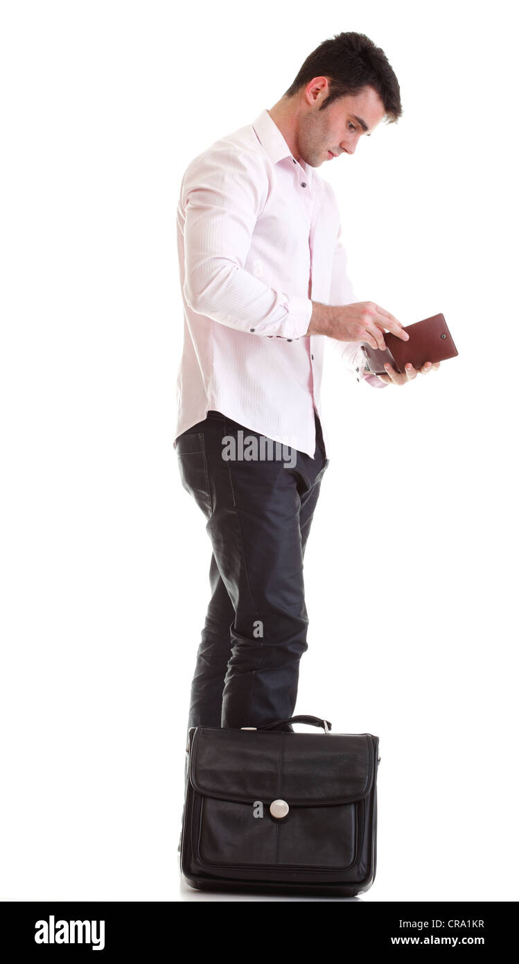 Business man looking at his empty wallet. Isolated on a white ...