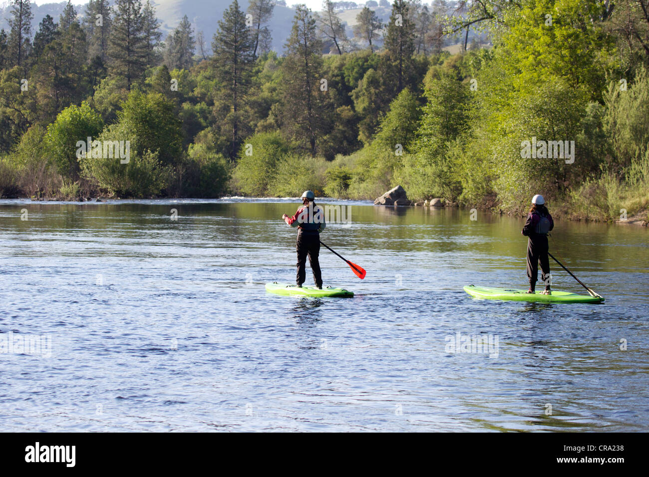 Stand up and paddle (SUP) boarders paddling on the Suth fork American ...