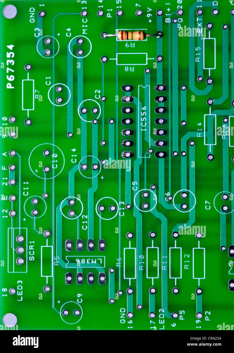 PC Circuit board with a schematic printed on it with a single resistor ...