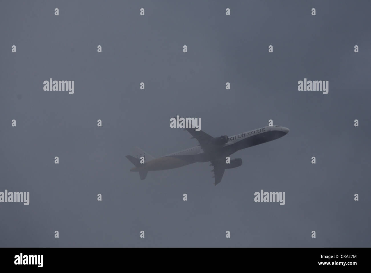 Plane in Mist Flying over Kinder Scout Stock Photo - Alamy