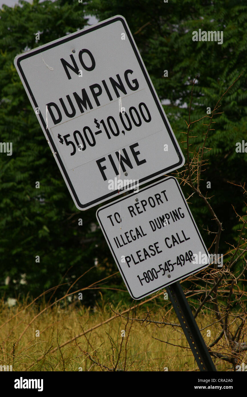 A sign posted to discourage illegal dumping in Detroit's west side ...