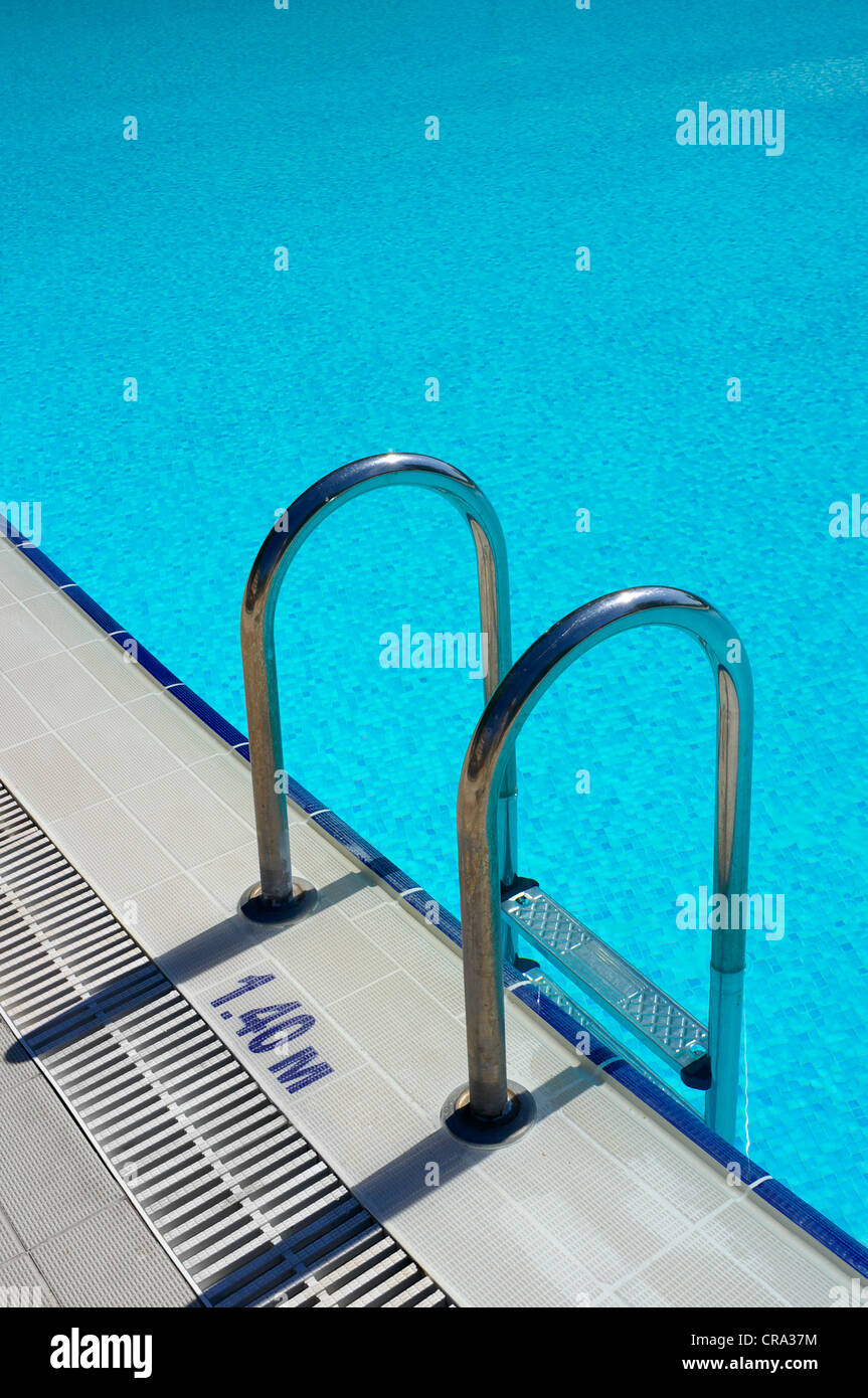 Aluminium steps into a swimming pool Stock Photo - Alamy