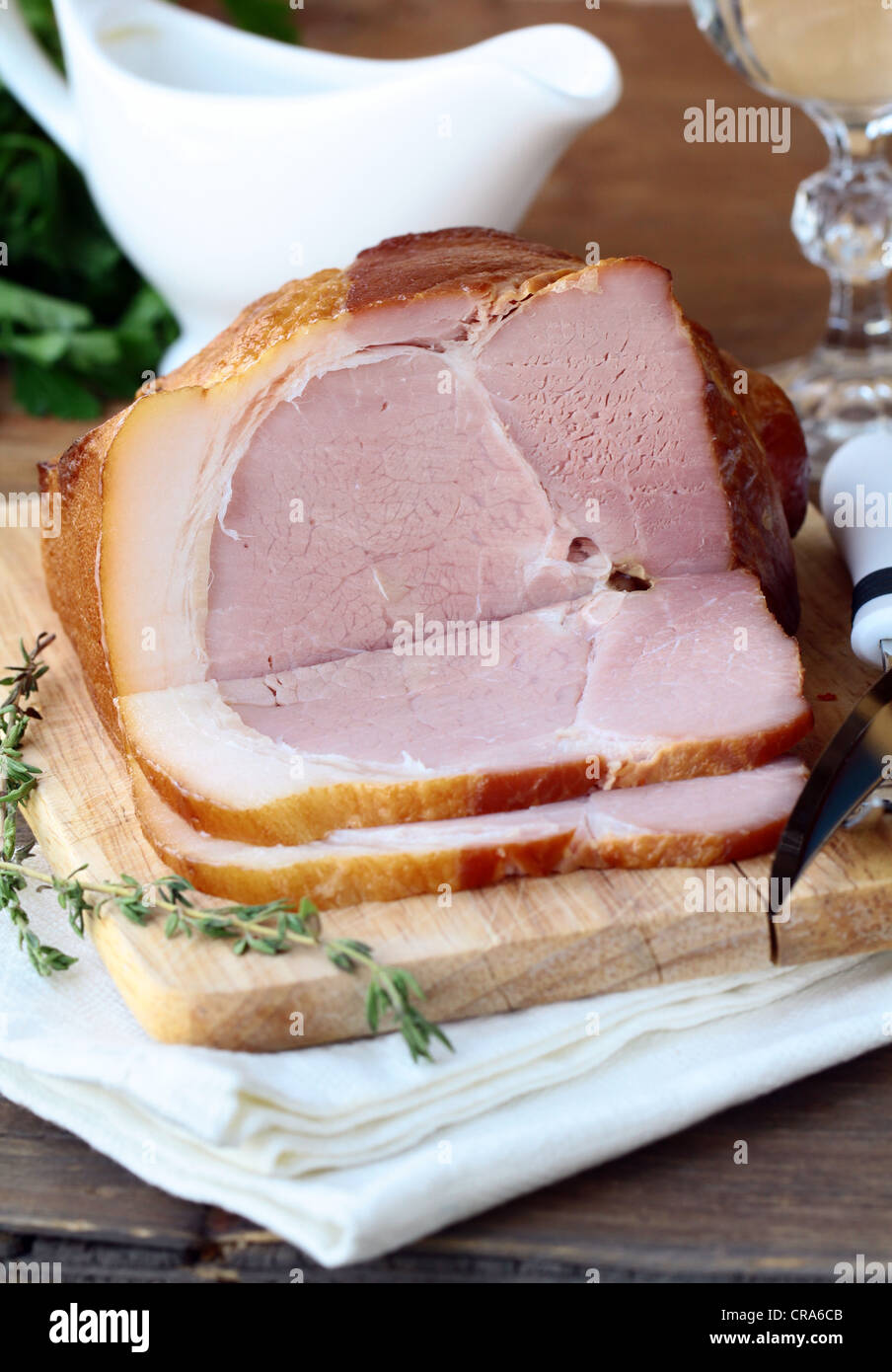 Baked ham served with lettuce and herbs Stock Photo - Alamy