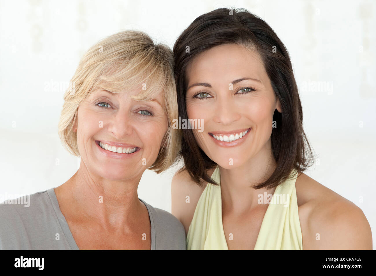 Smiling women standing together Stock Photo - Alamy