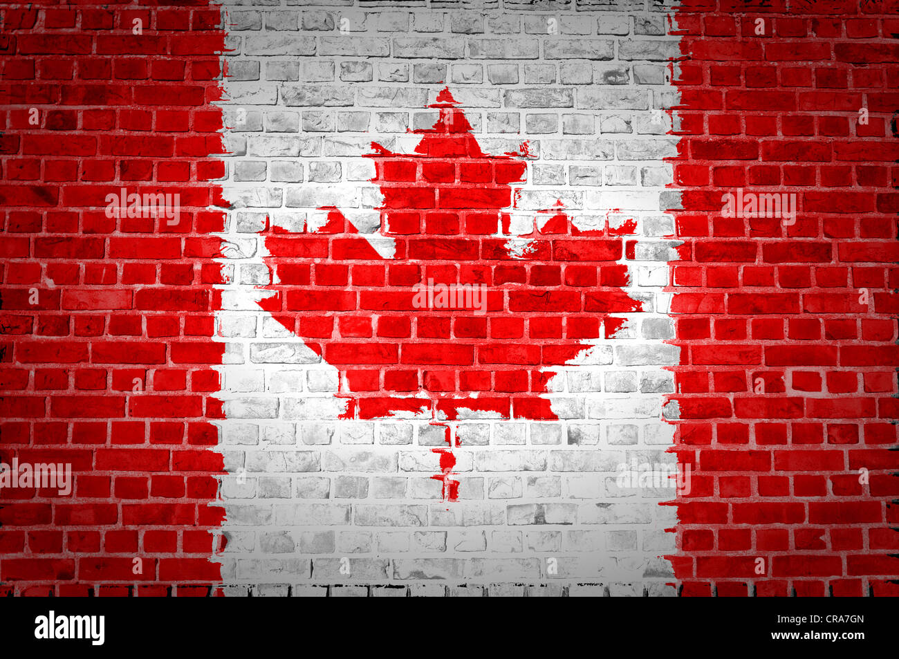 An image of the Canada flag painted on a brick wall in an urban ...