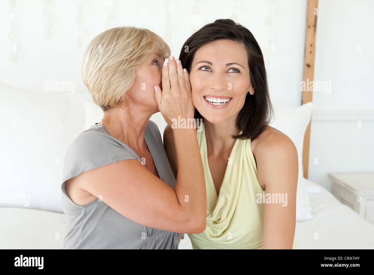 Whispering to each other hi-res stock photography and images - Alamy