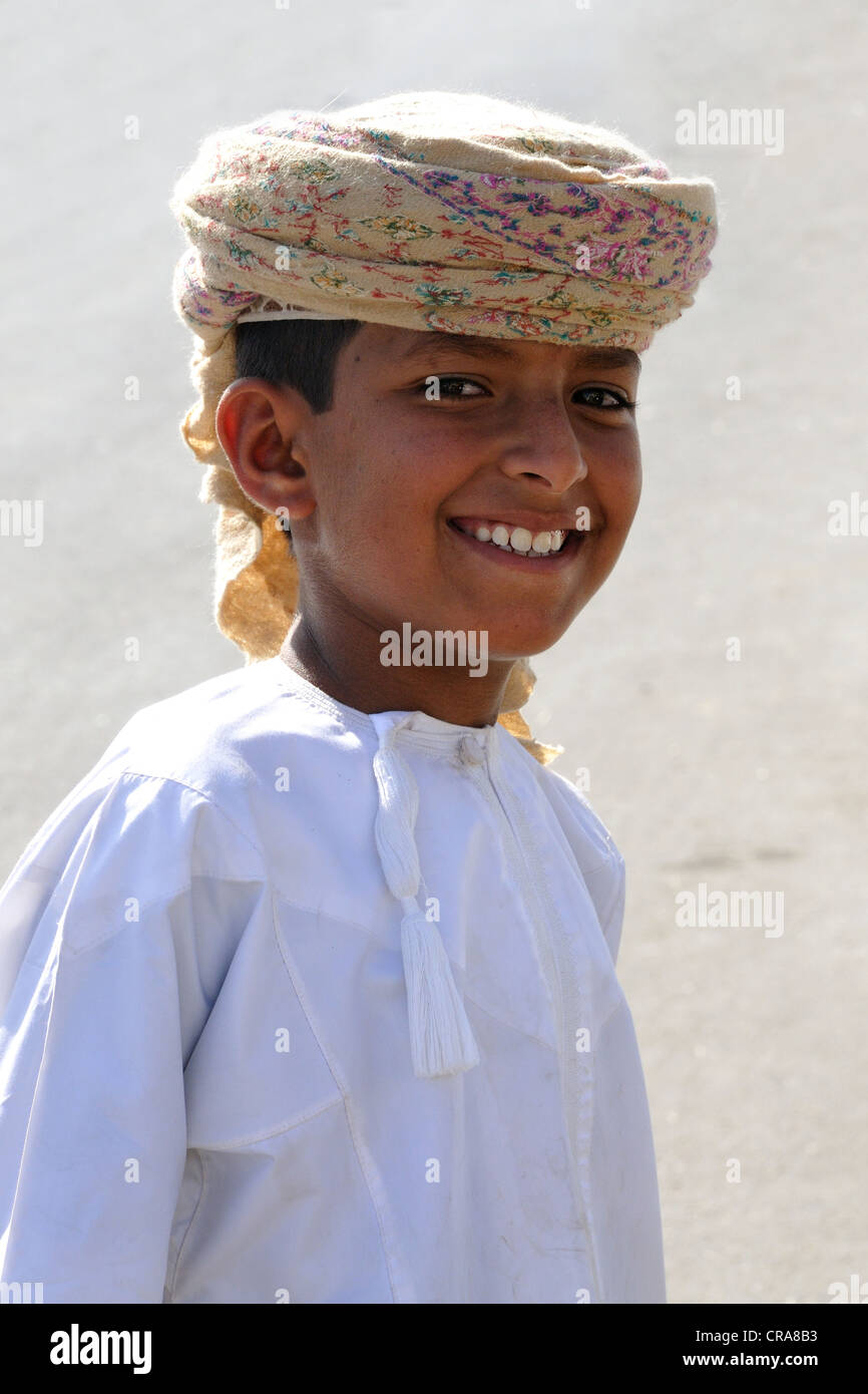 Boy from Oman in traditional costume on the market in Nizwa, Oman ...