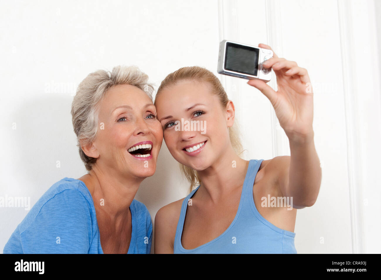 Woman taking family photo hi-res stock photography and images - Alamy