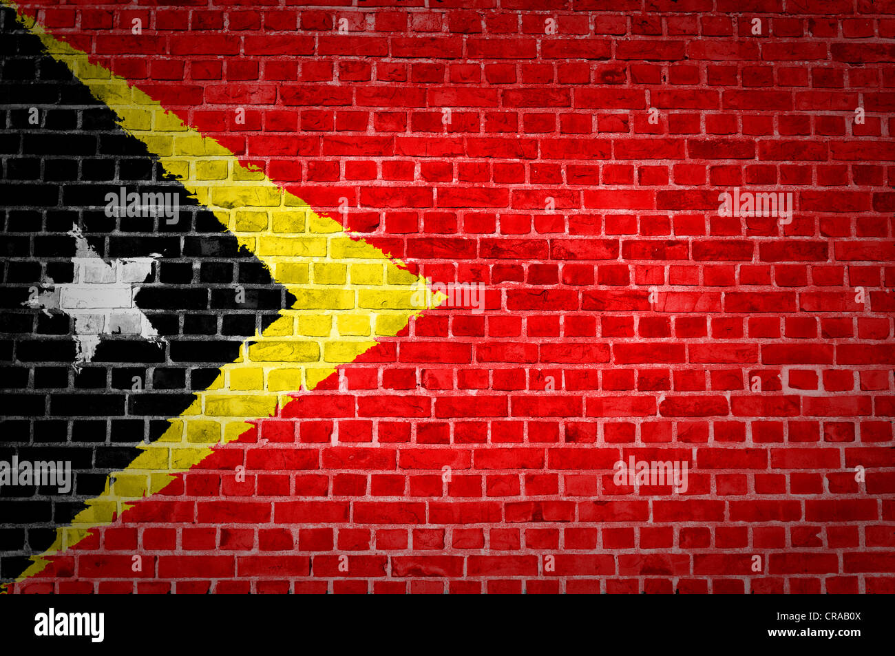 An image of the Timor-Leste flag painted on a brick wall in an urban ...