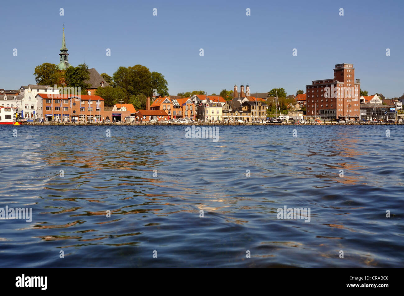 Row of houses by the harbour with grain silo and eel smokehouse ...