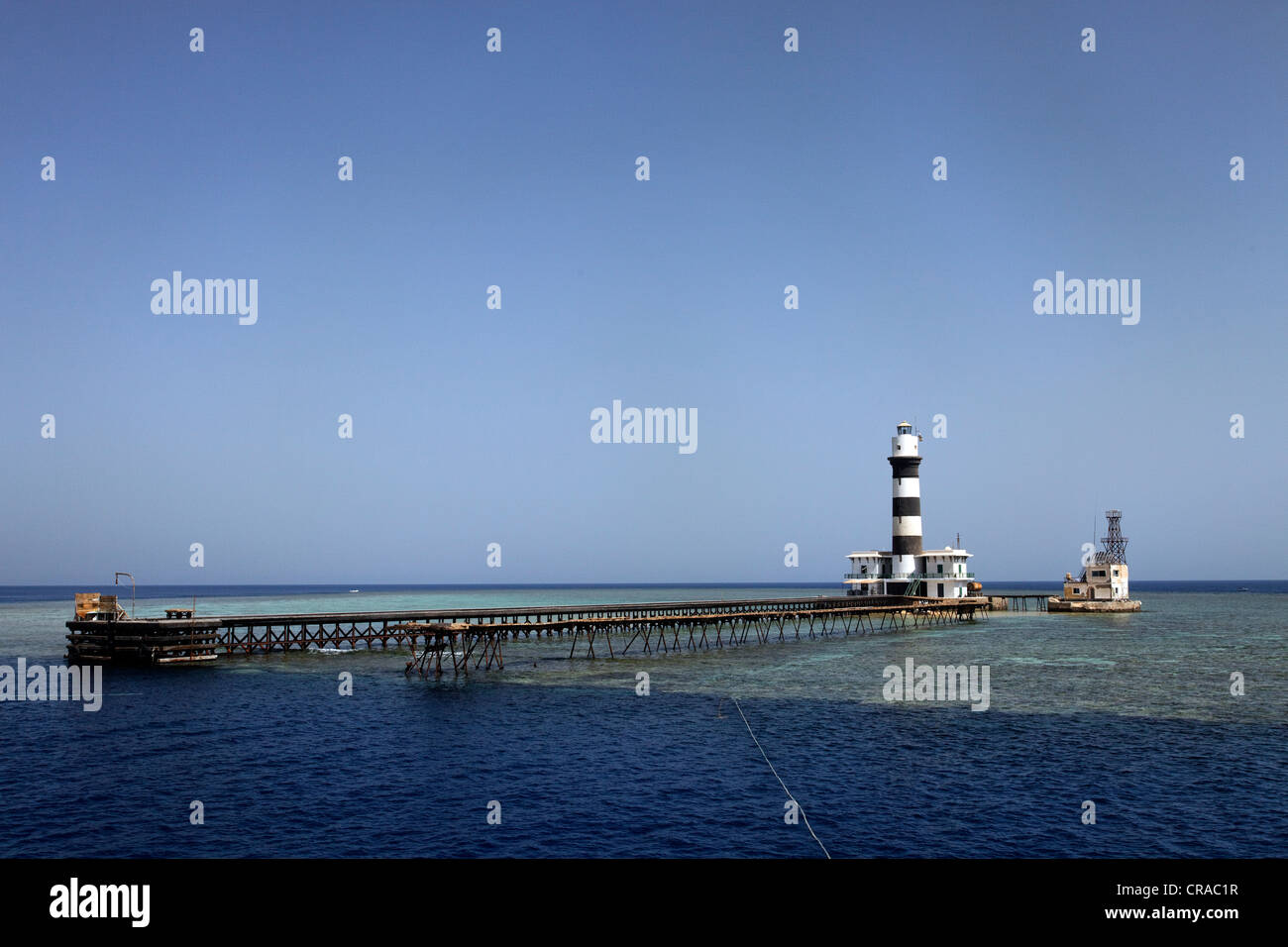Lighthouse with jetty and coral reef, Daedalus Reef, Egypt, Red Sea ...