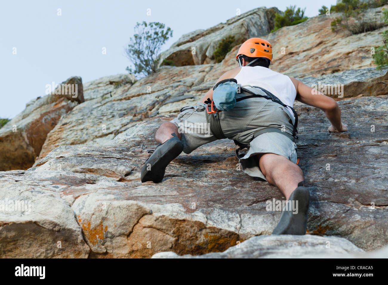 Climber scaling steep rock face Stock Photo - Alamy Climber scaling steep rock face Stock Photo - Alamy